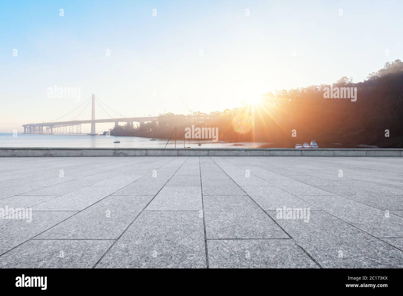 empty floor near modern suspension bridge with sunbeam Stock Photo - Alamy