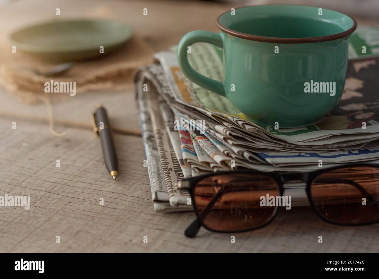 Stack of newspapers on table hi-res stock photography and images - Alamy
