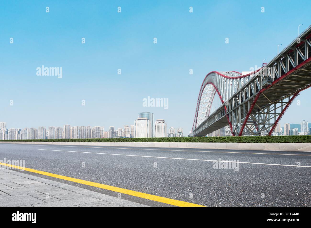 empty road near steel bridge in modern city Stock Photo - Alamy