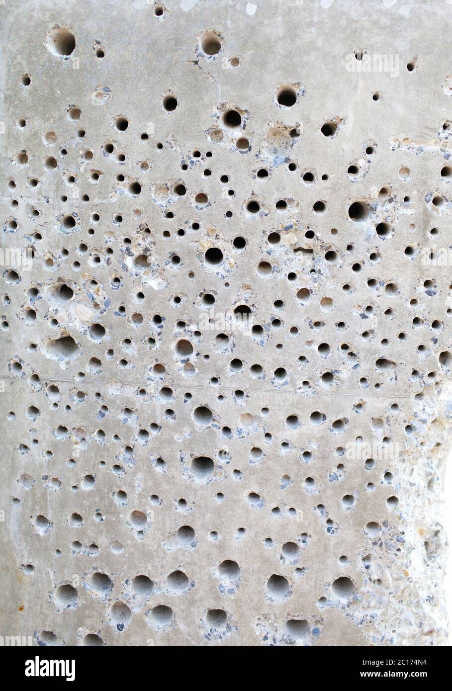 concrete wall with holes from the puncher Stock Photo - Alamy