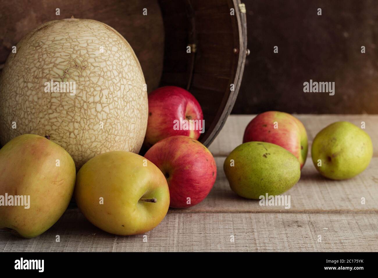 apples and melon on wooden Stock Photo - Alamy