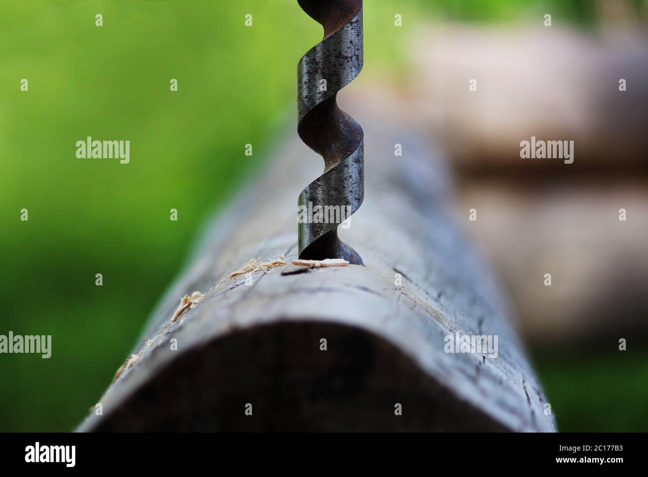 Metal spiral drill for making holes in logs when assembling a wooden ...