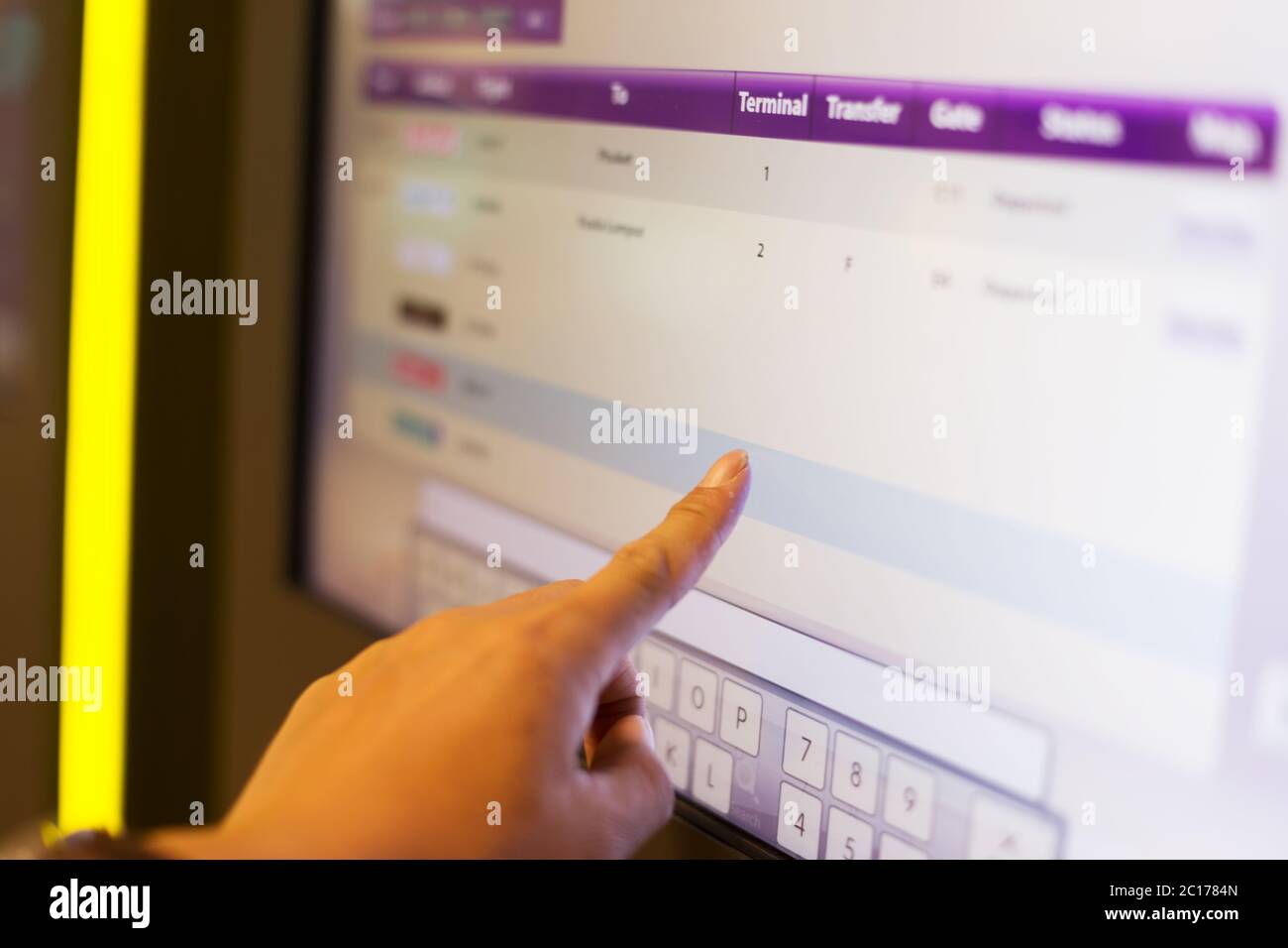 finger touching digital screen with flight information Stock Photo - Alamy