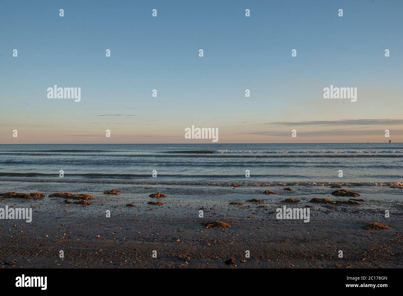 Bolivar Peninsula beach at sunset Stock Photo - Alamy