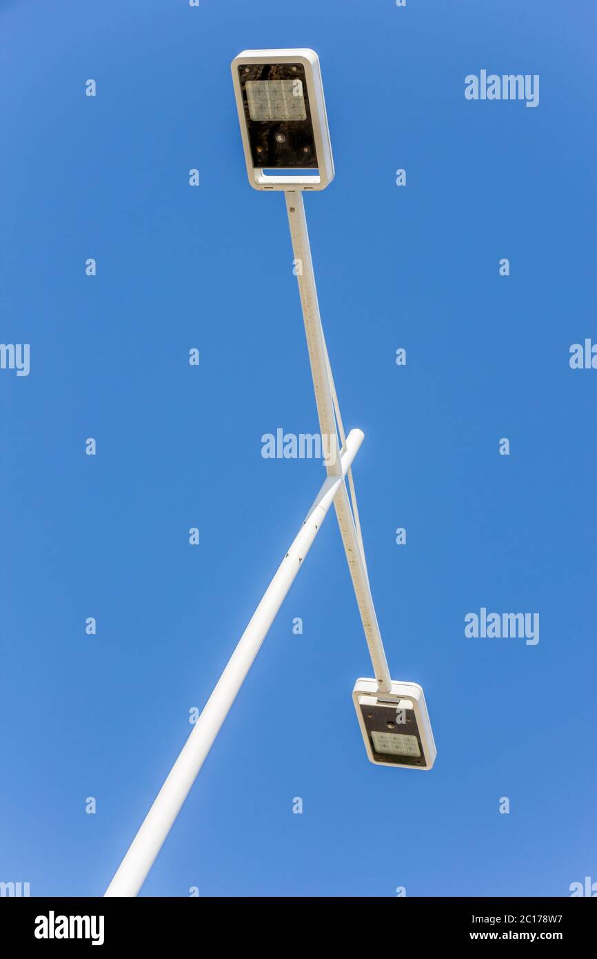 Light post isolated with blue sky background Stock Photo - Alamy