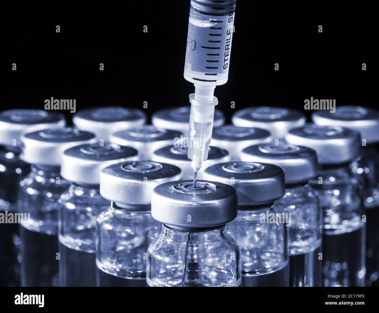 Glass Medicine Vials and Syringe. Tinted image Stock Photo - Alamy