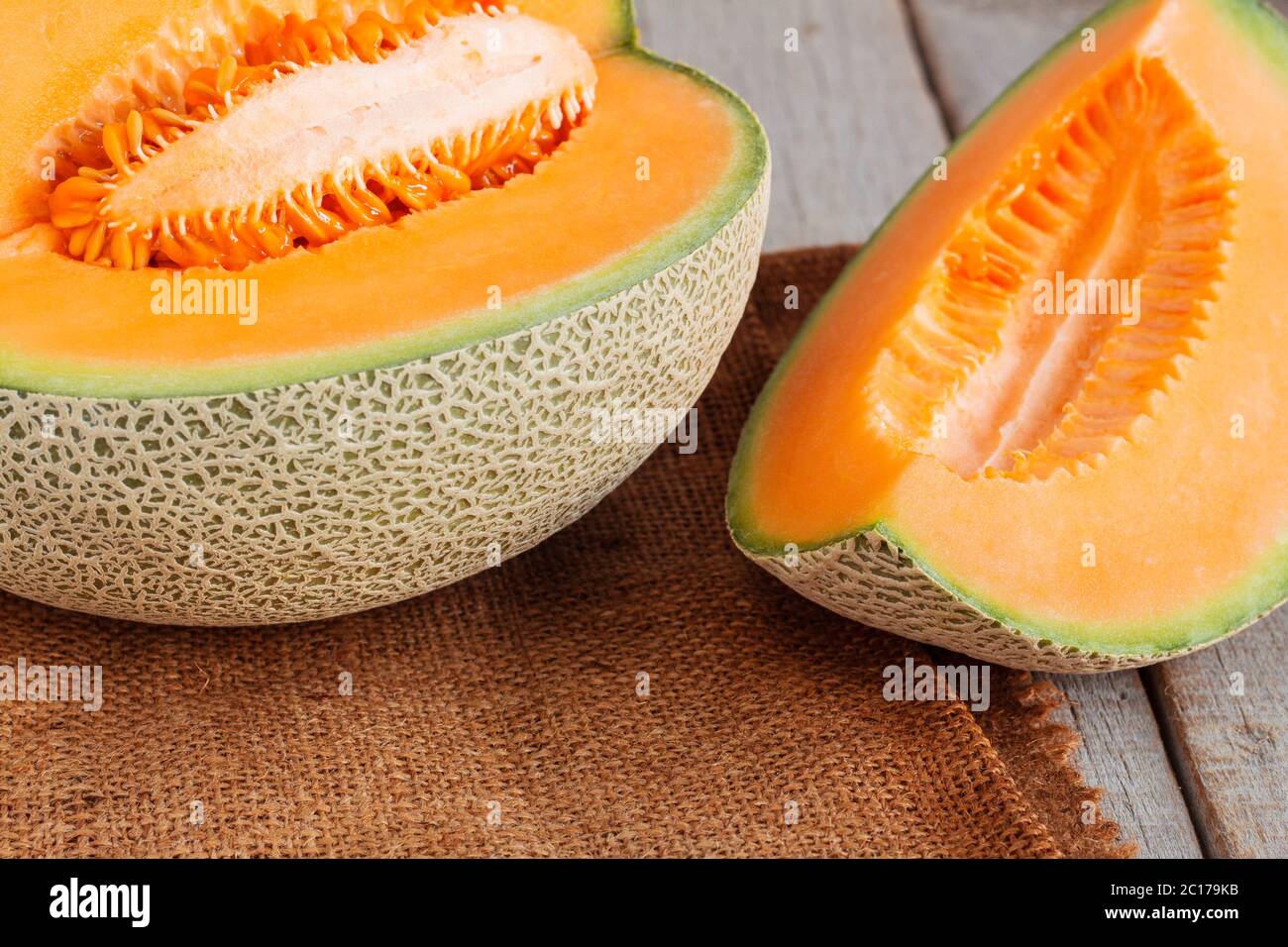 Melon sliced on wooden hi-res stock photography and images - Alamy