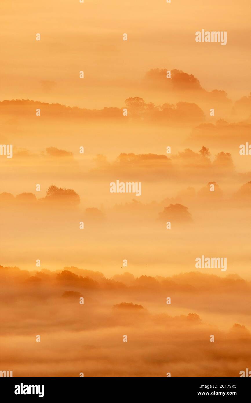 Early morning mist covers the English countryside in Autumn. Malvern ...