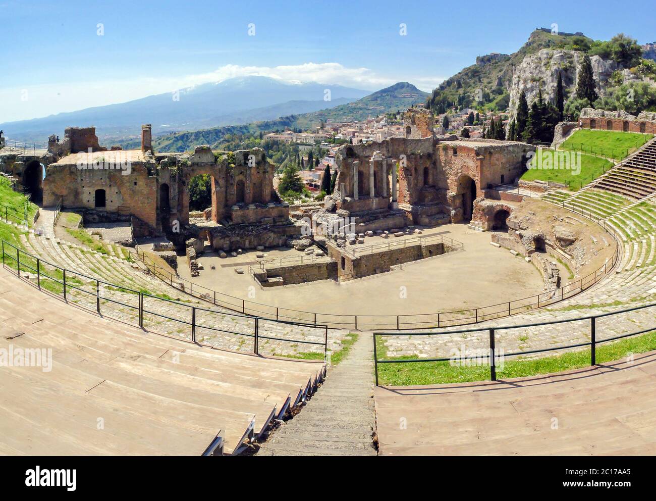 The famous and beautiful ancient greek theatre ruins Taormina with Etna ...