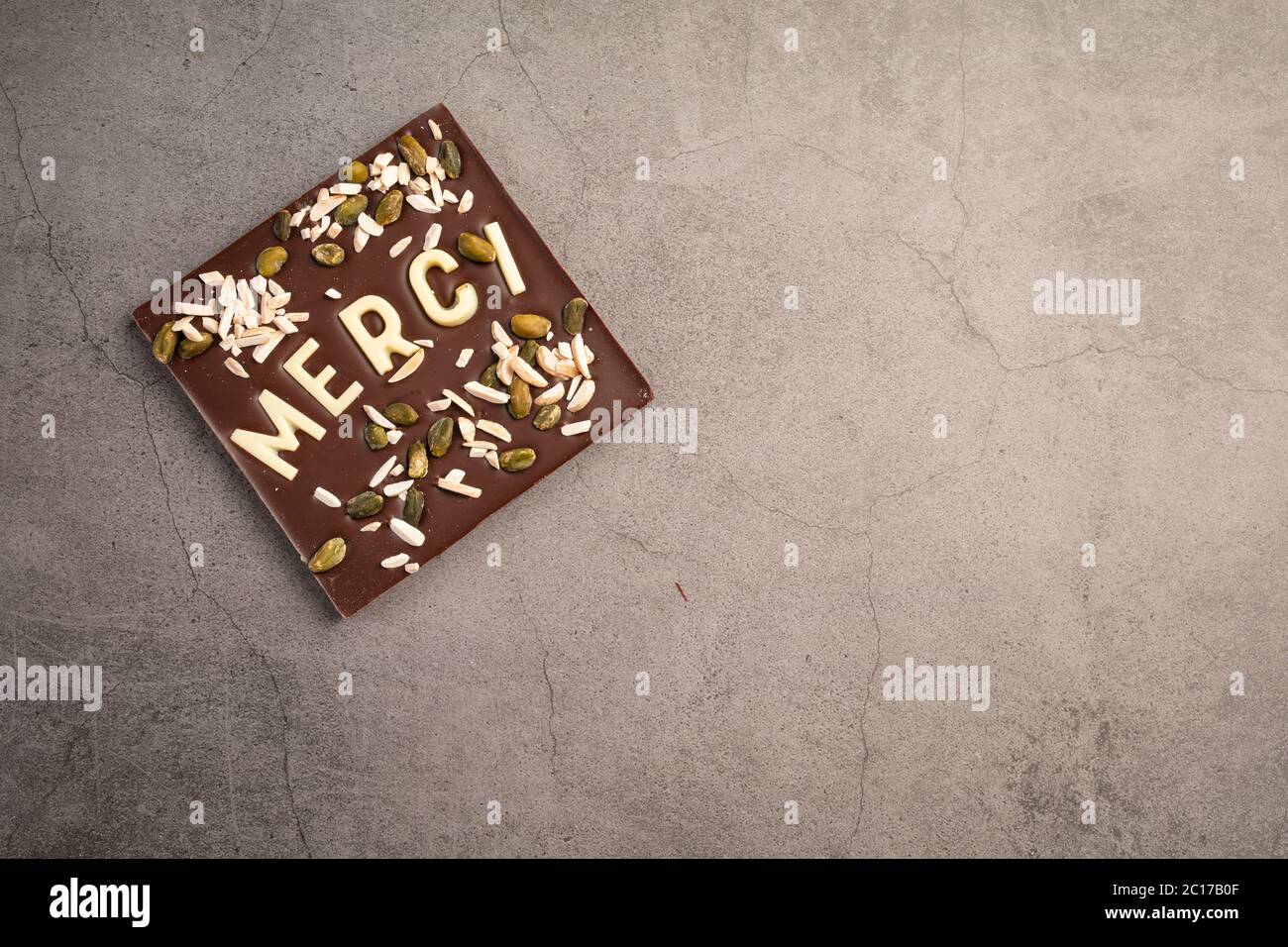 Dark chocolate square with white chocolate thank you note with space to ...