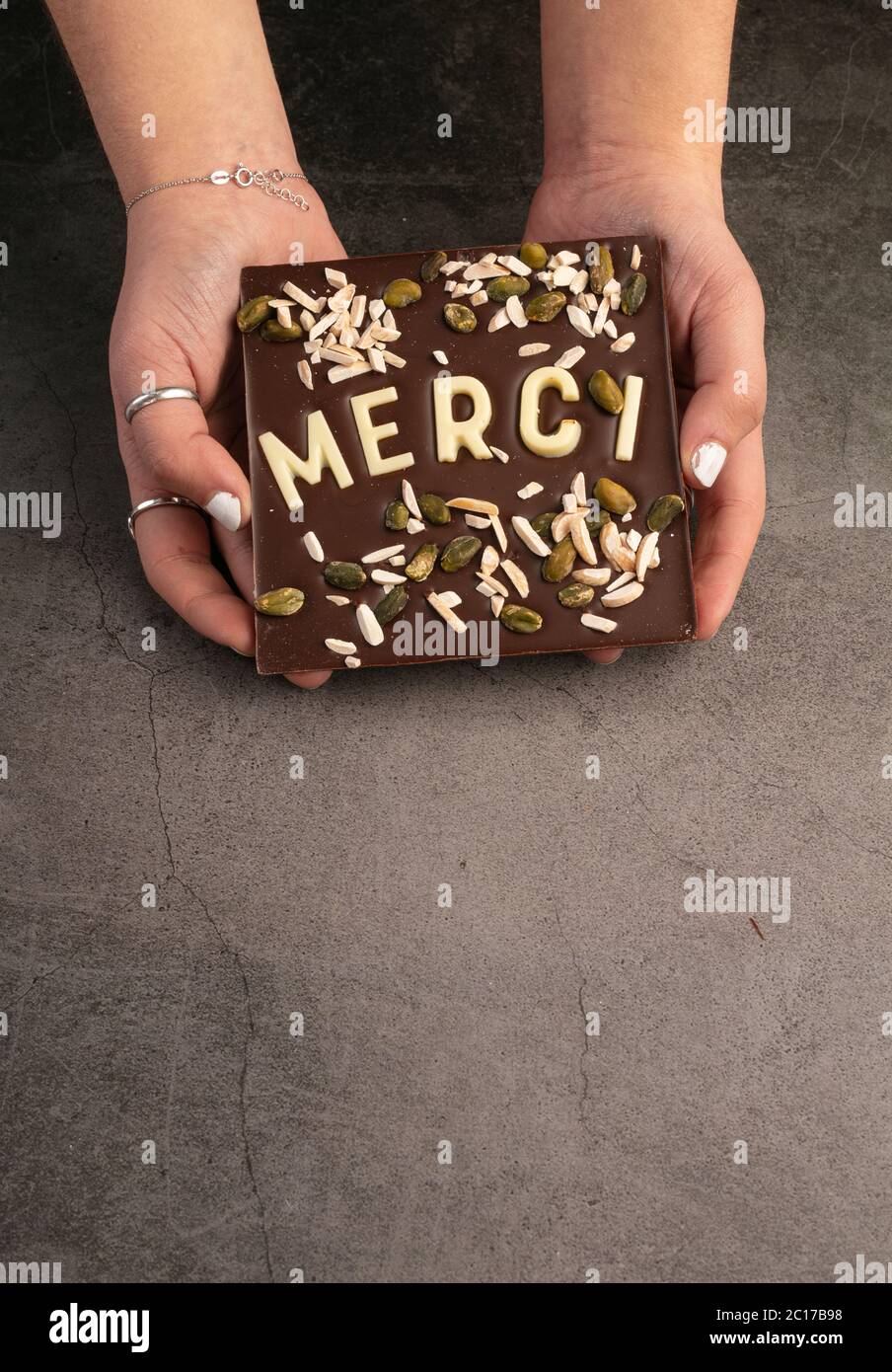 Dark chocolate square with white chocolate thank you note with space to ...