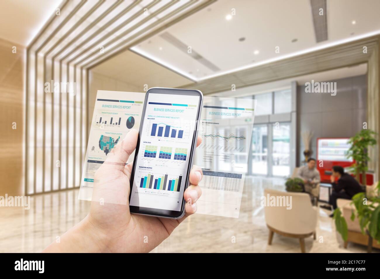 mobile phone with mobile office in modern hall Stock Photo - Alamy