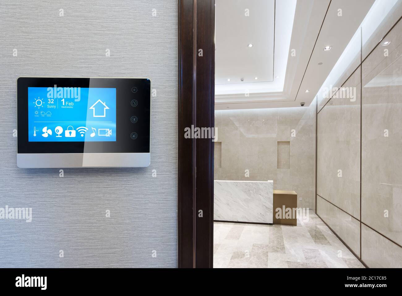 smart screen on wall with reception desk Stock Photo - Alamy