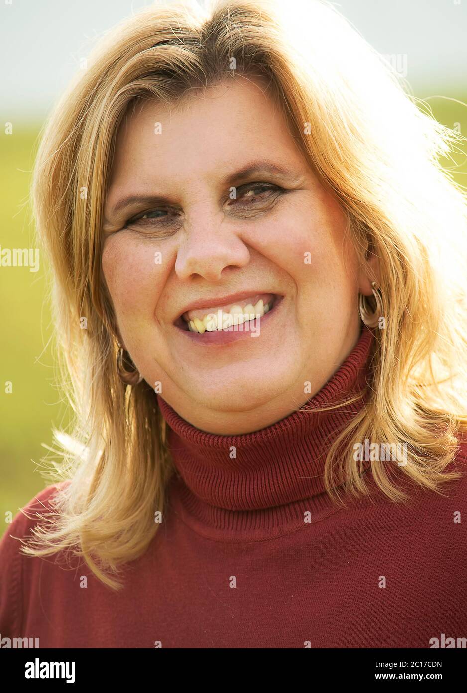 Portrait of a pretty middle-aged woman laughing Stock Photo - Alamy
