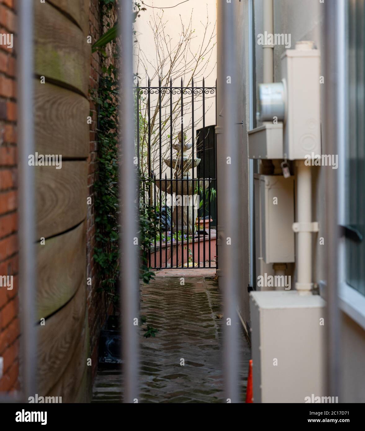 Water Fountain Down Locked Alley Way behind utilities boxes Stock Photo ...
