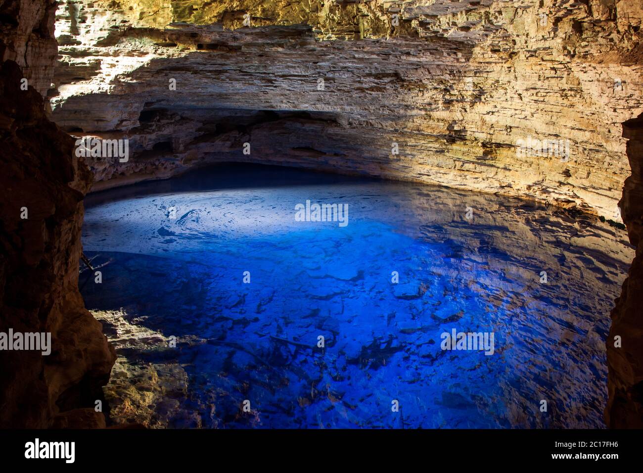 Poco Encantado, blue lagoon with sunrays inside a cavern in the Chapada ...