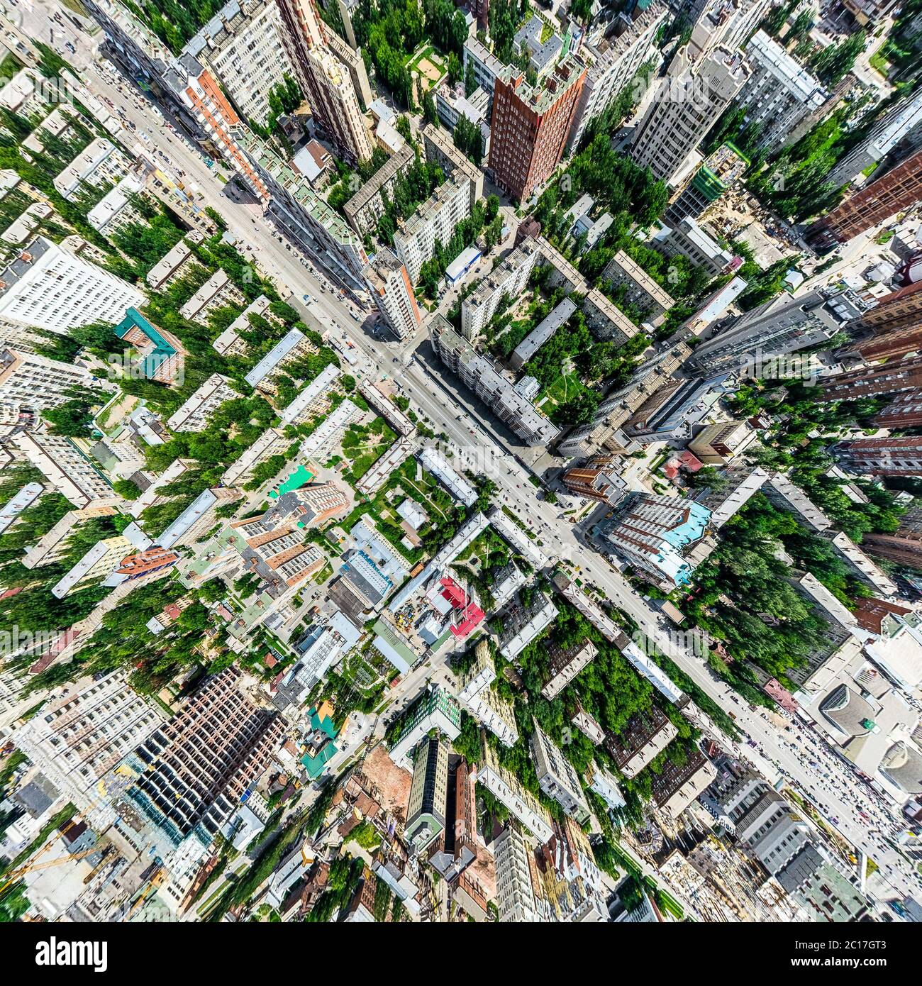 Aerial city view with crossroads and roads, houses, buildings, parks ...