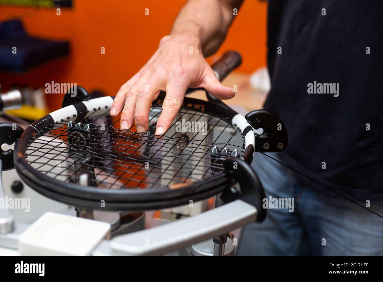 Process of stringing a tennis racket in a tennis shop, sport and ...