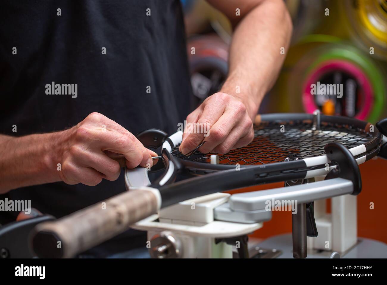 Process of stringing a tennis racket in a tennis shop, sport and ...