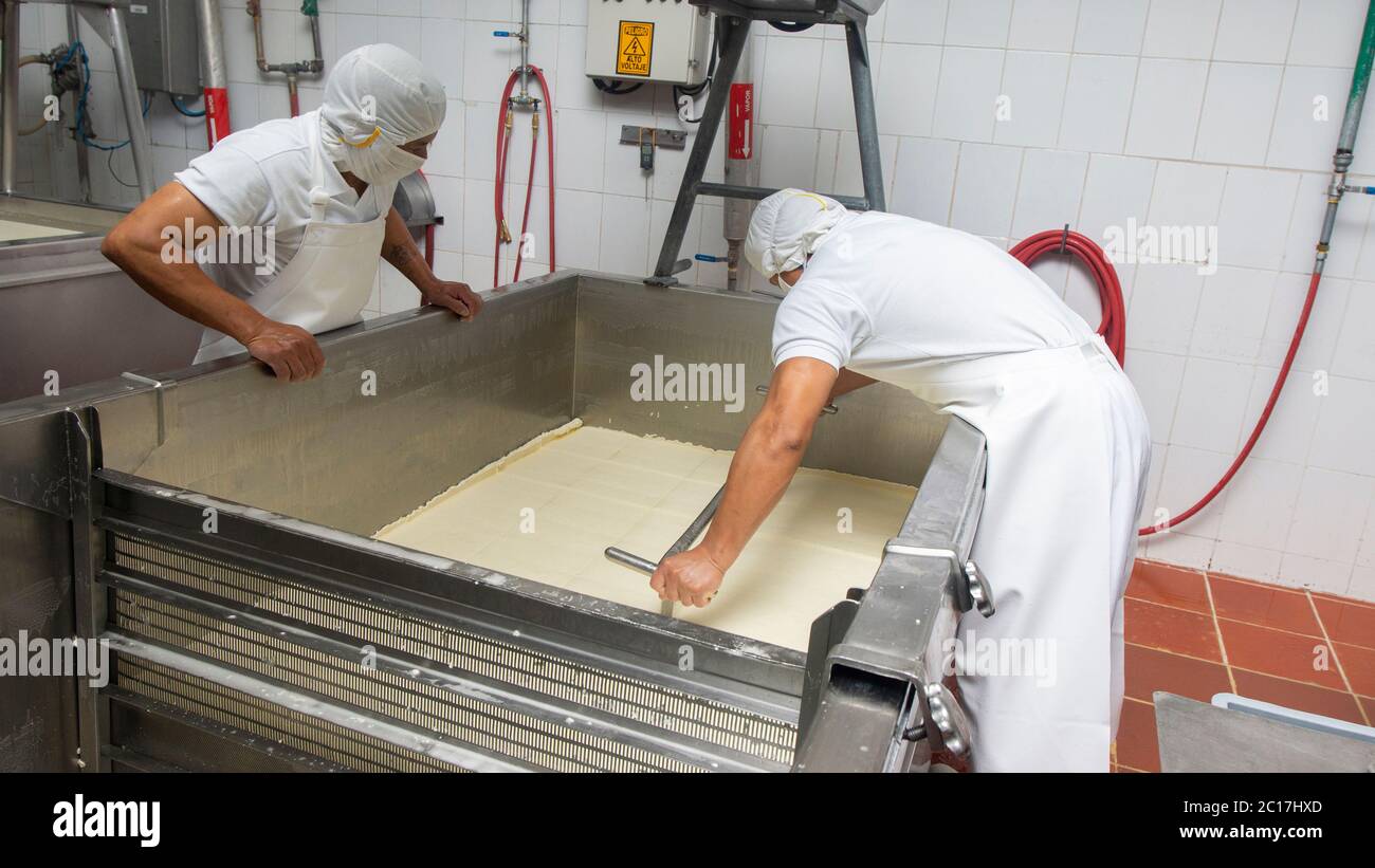Zuleta, Imbabura / Ecuador - November 9 2018: Worker cutting blocks of ...