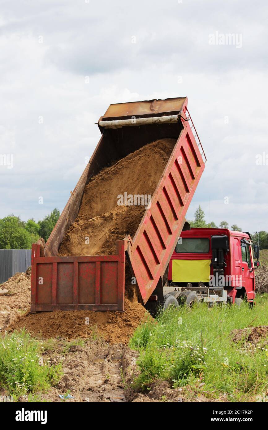 Truck dumping rock into water hi-res stock photography and images - Alamy