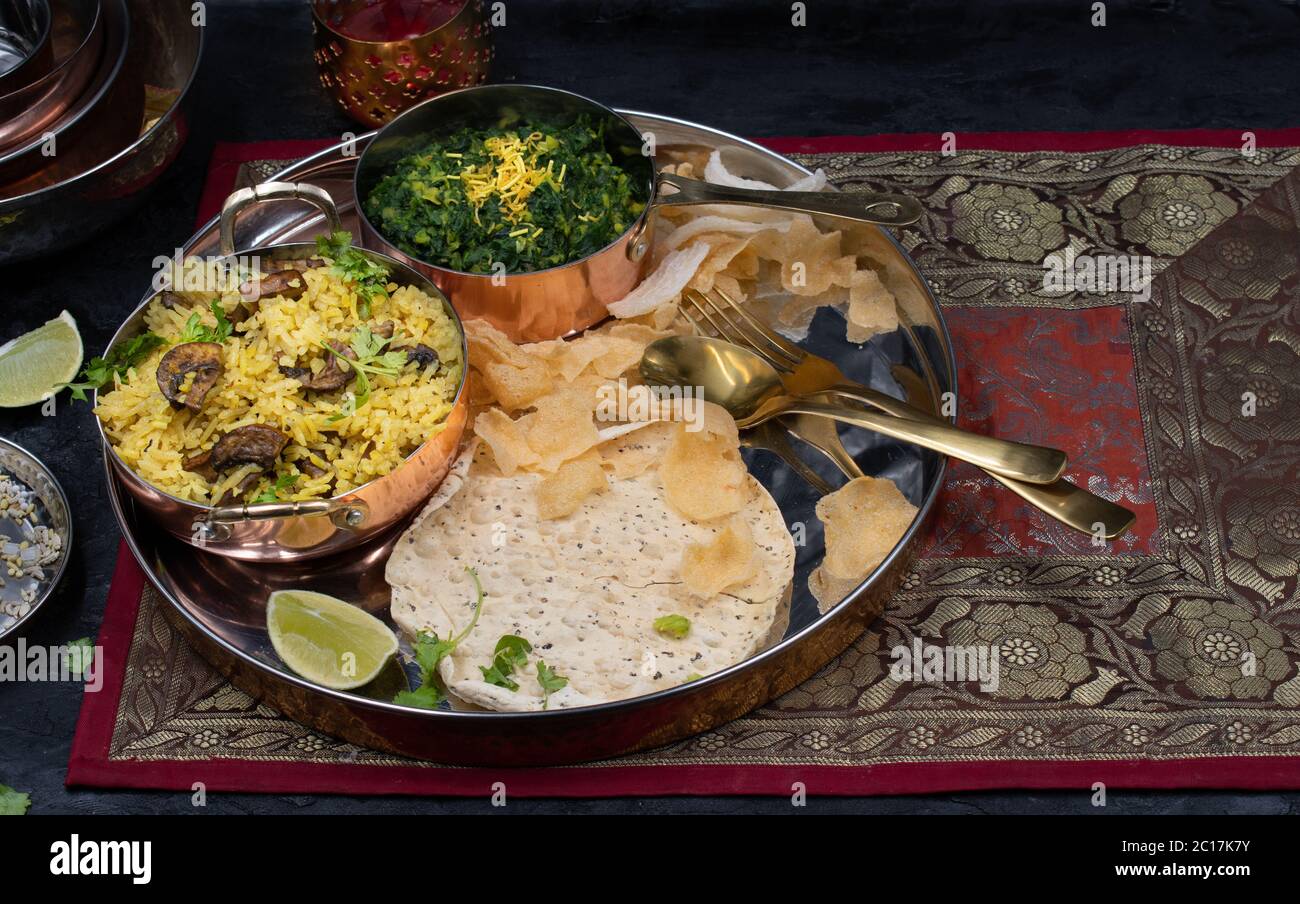 Vegan North Indian mushroom pilaf and spinach served in traditional ...