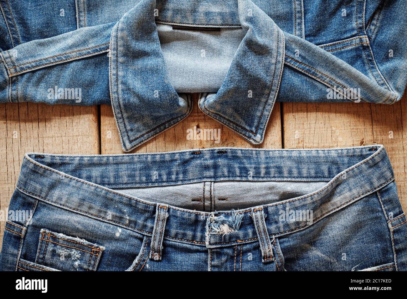 Old jeans on wooden Stock Photo - Alamy