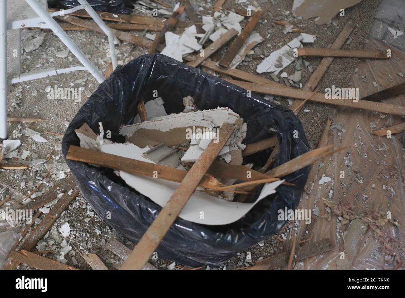 Trash bin with construction demolition debris Stock Photo - Alamy