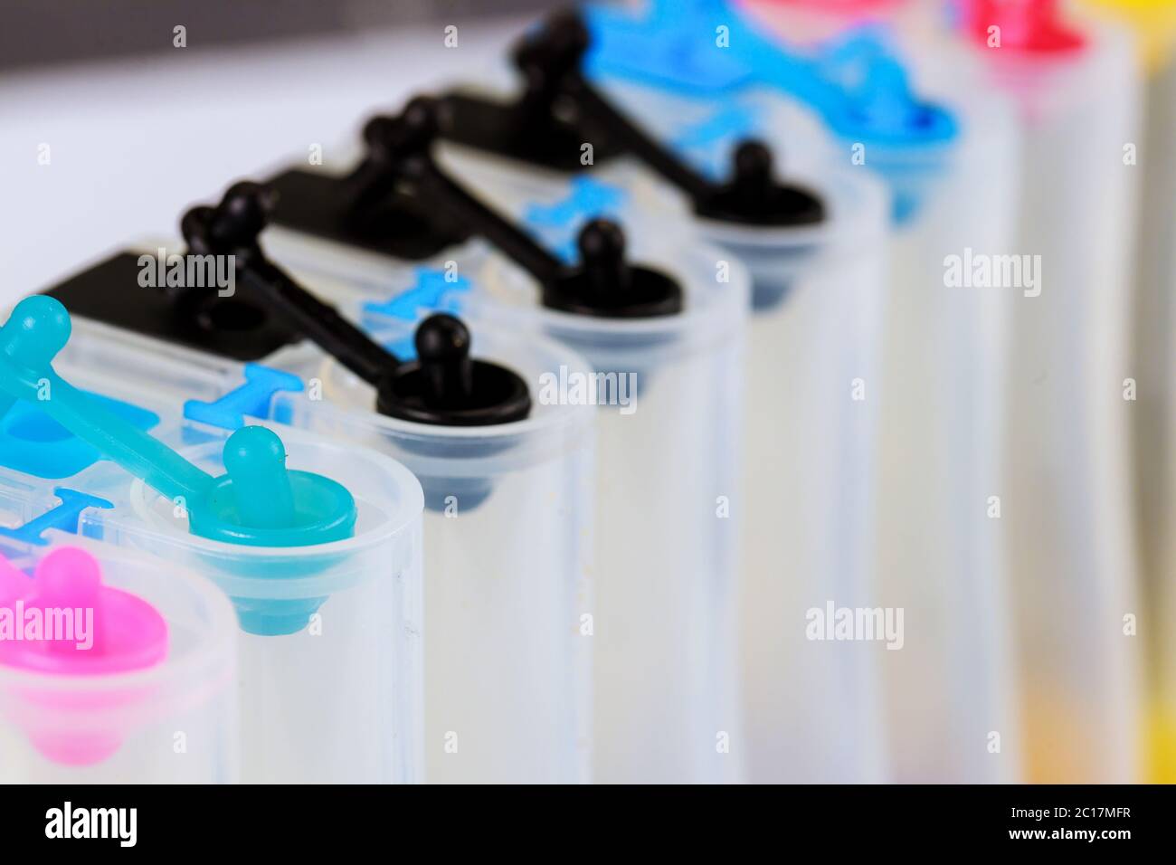 Close up select focus color CMYK ink tank on inkjet printer Stock Photo ...