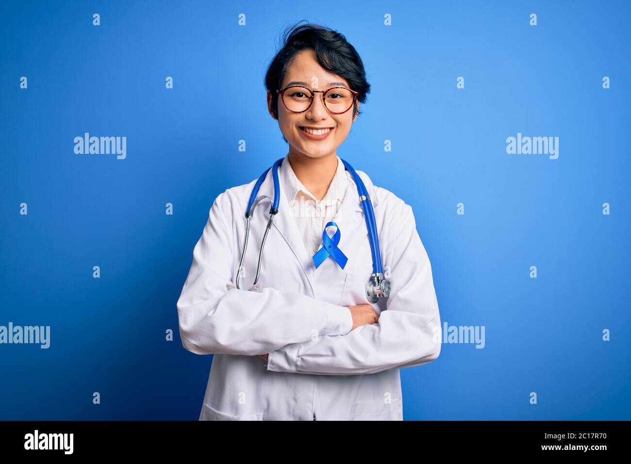 Young beautiful asian doctor girl wearing stethoscope and coat with ...