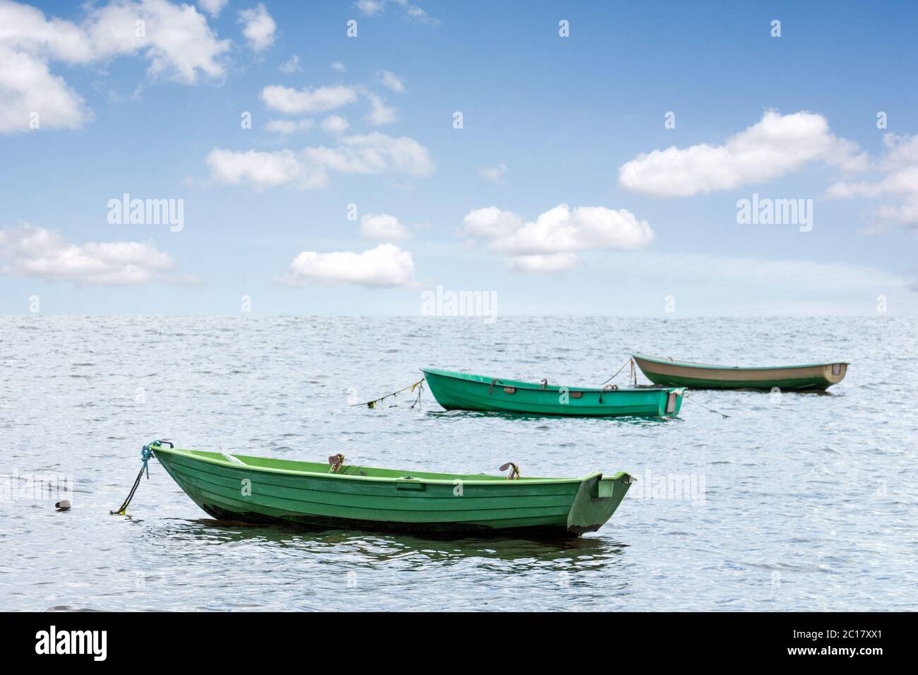 Three wooden boats at sea Stock Photo - Alamy
