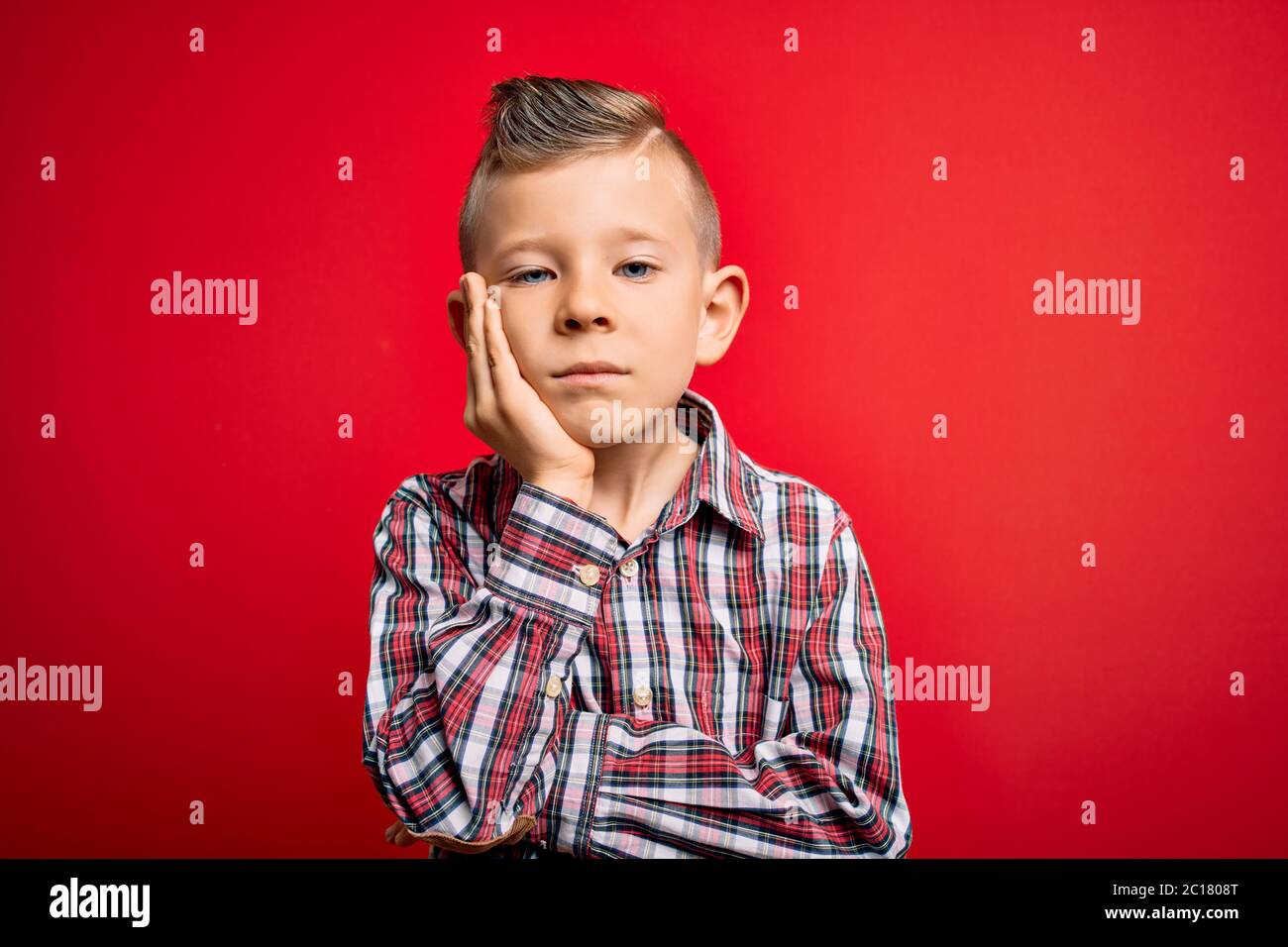 Young little caucasian kid with blue eyes standing wearing elegant ...