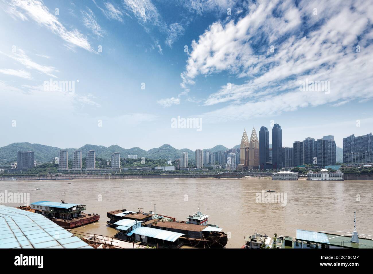 cityscape of modern city near river Stock Photo - Alamy