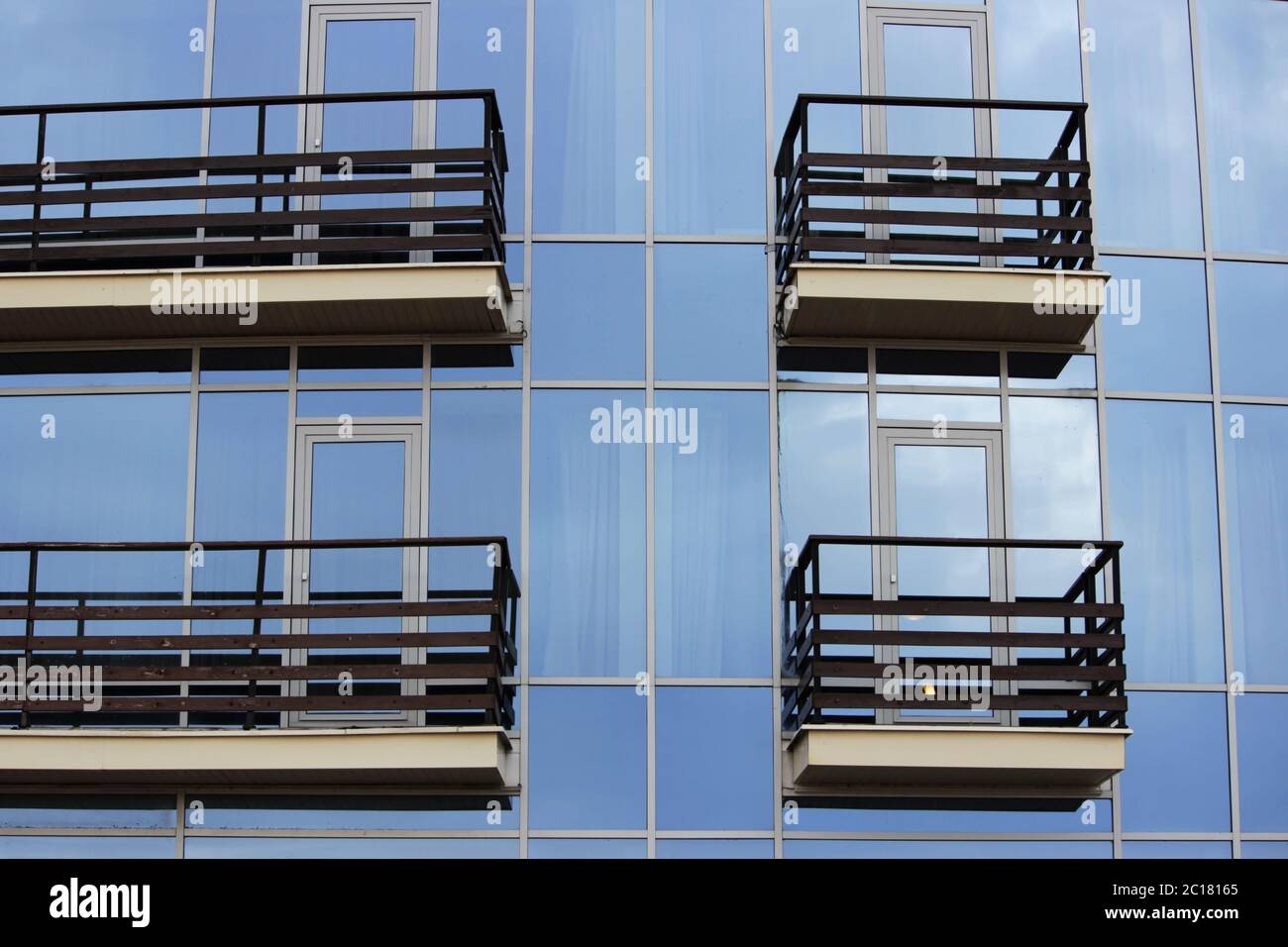 big transparent windows office building with sky reflection Stock Photo ...