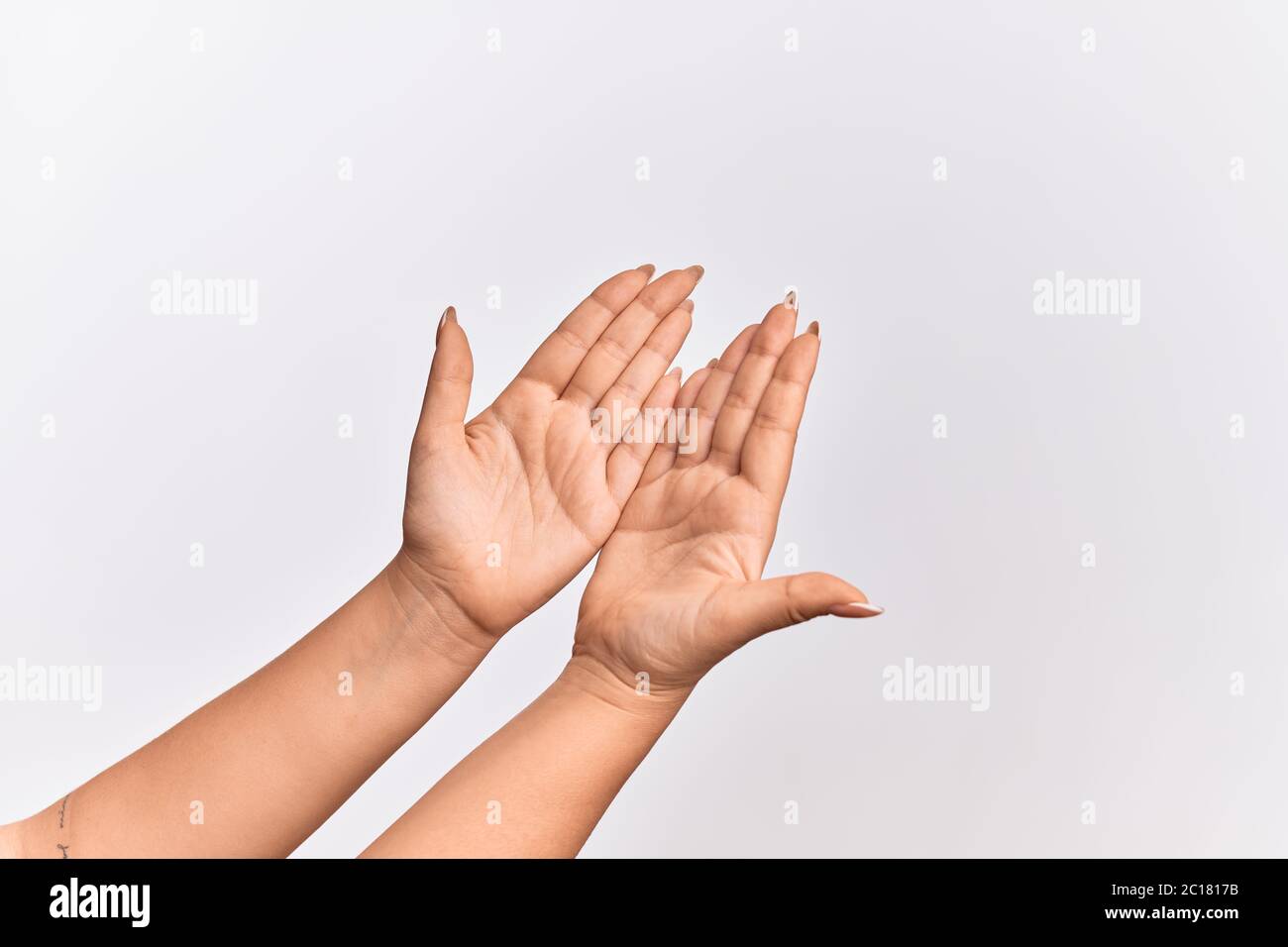 Hand of caucasian young woman showing both palms together, open hands ...