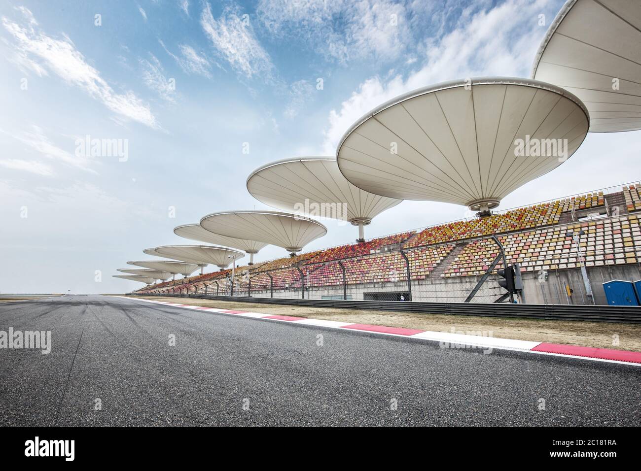 empty asphalt car racing track in blue cloud sky Stock Photo - Alamy