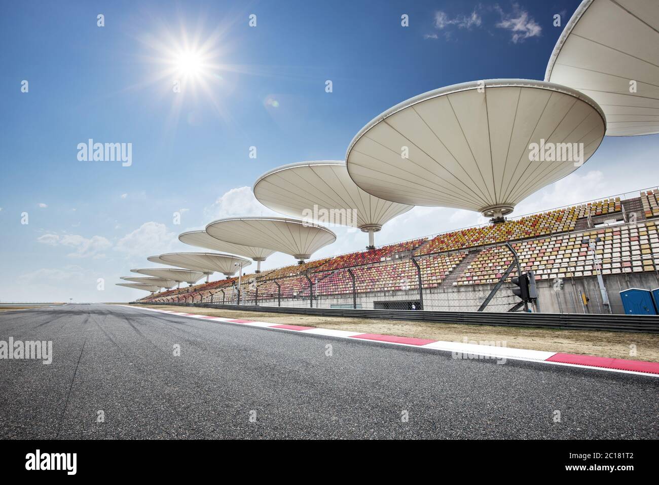 empty asphalt car racing track in blue sunny sky Stock Photo - Alamy