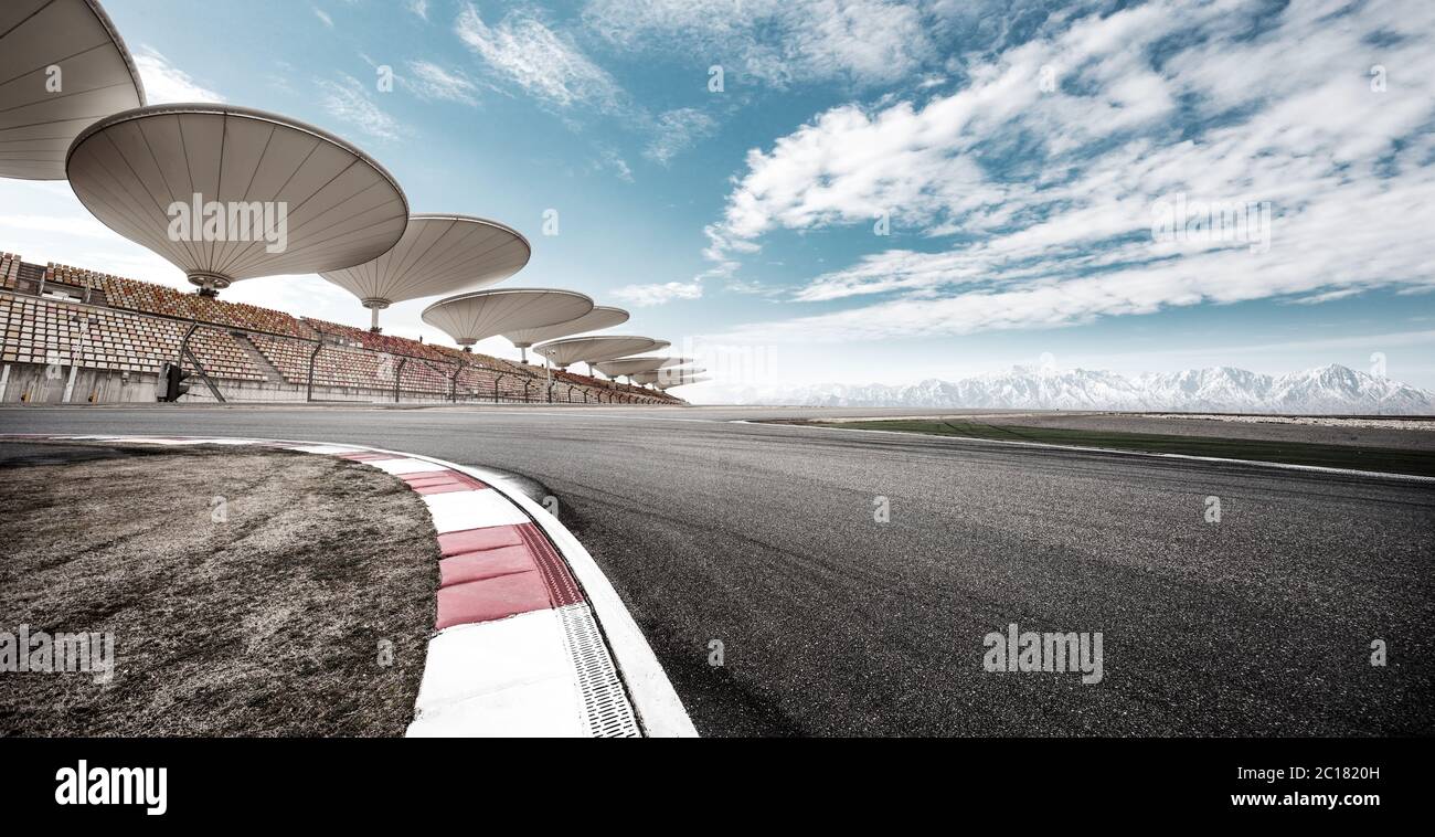 empty asphalt car racing track in blue cloud sky Stock Photo - Alamy
