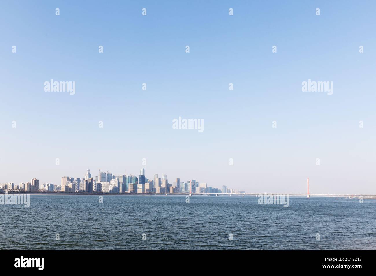 cityscape of modern city near river Stock Photo - Alamy