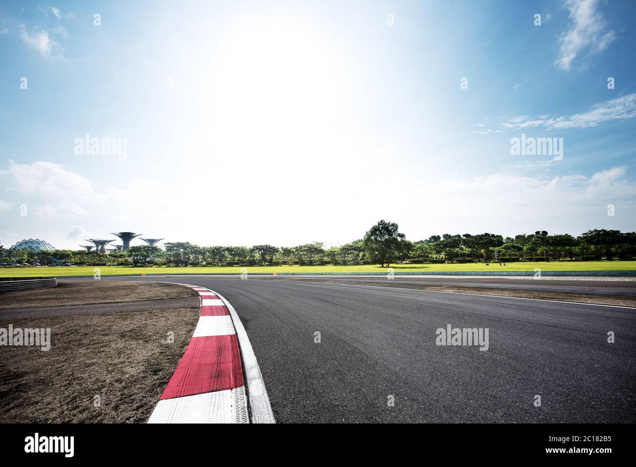 empty road near meadow in blue sky Stock Photo - Alamy