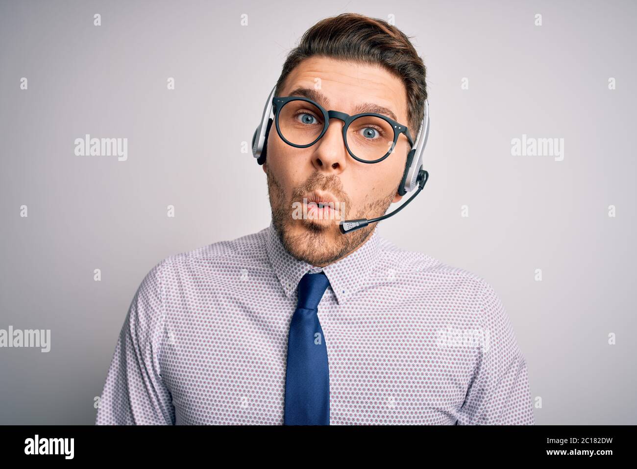 Young call center operator business man with blue eyes wearing glasses ...