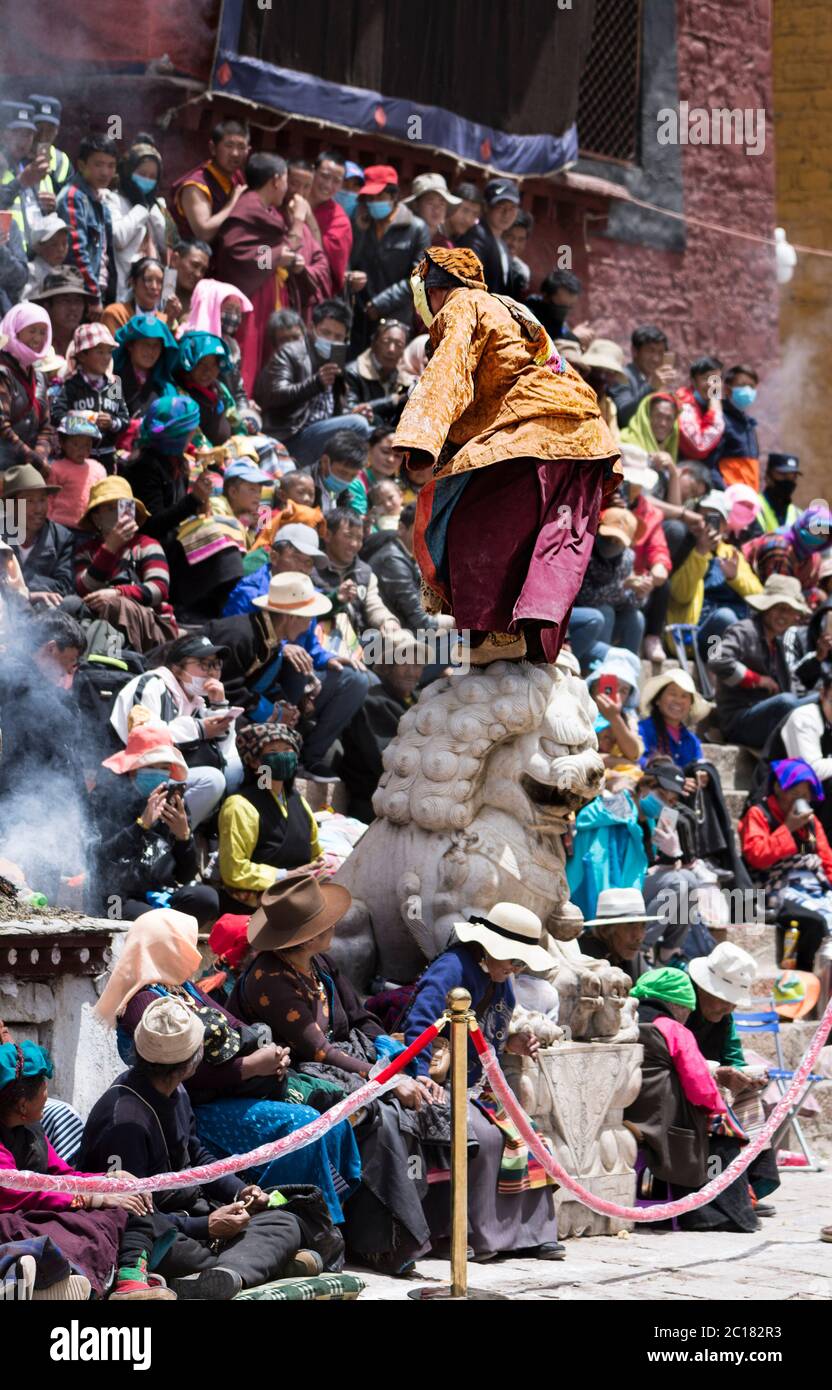 A clown performs during an pause in the sacred cham dancing providing ...