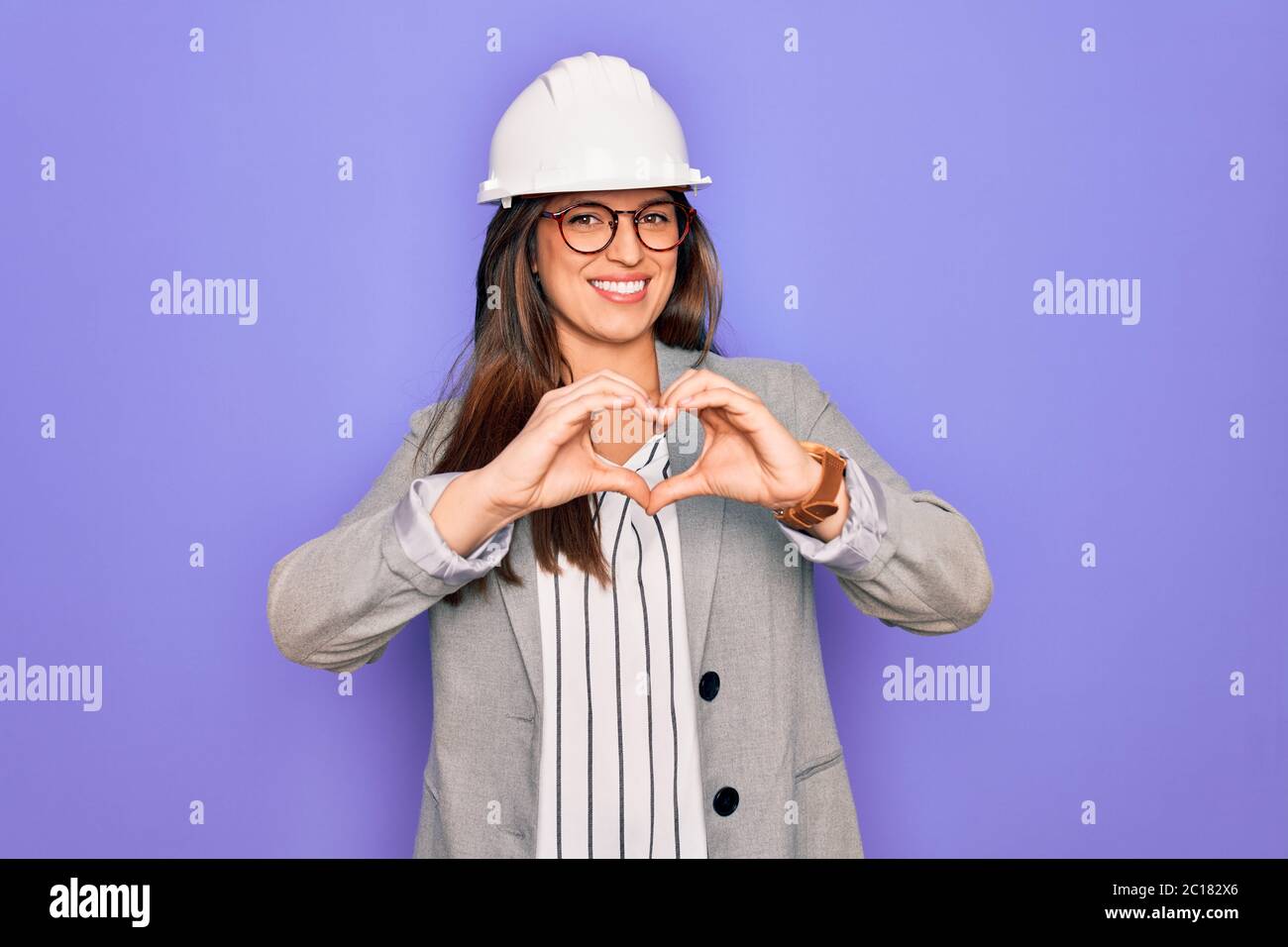 Professional woman engineer wearing industrial safety helmet over ...