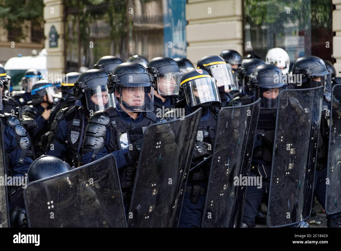 Paris, France. 13th June, 2020. Riot police charge protesters and use ...