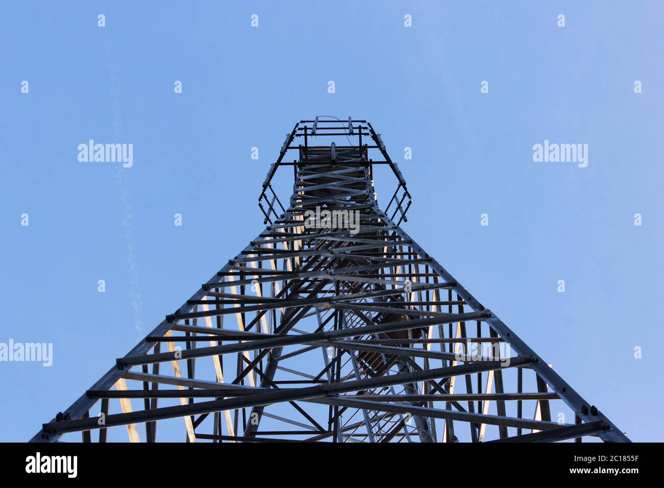 Large tower of metal structures against the blue sky. Metal ...