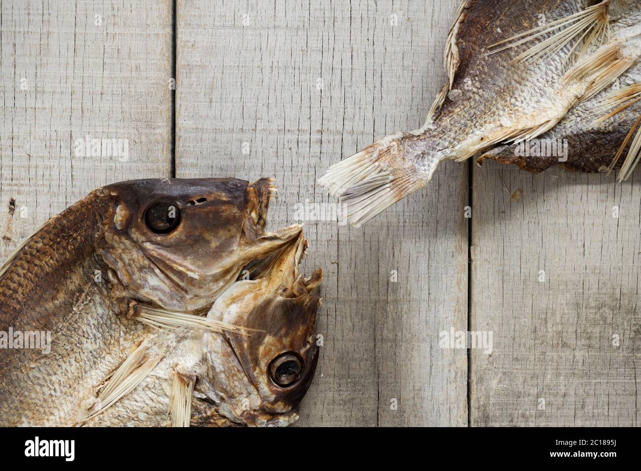 Dried fish on wooden Stock Photo - Alamy