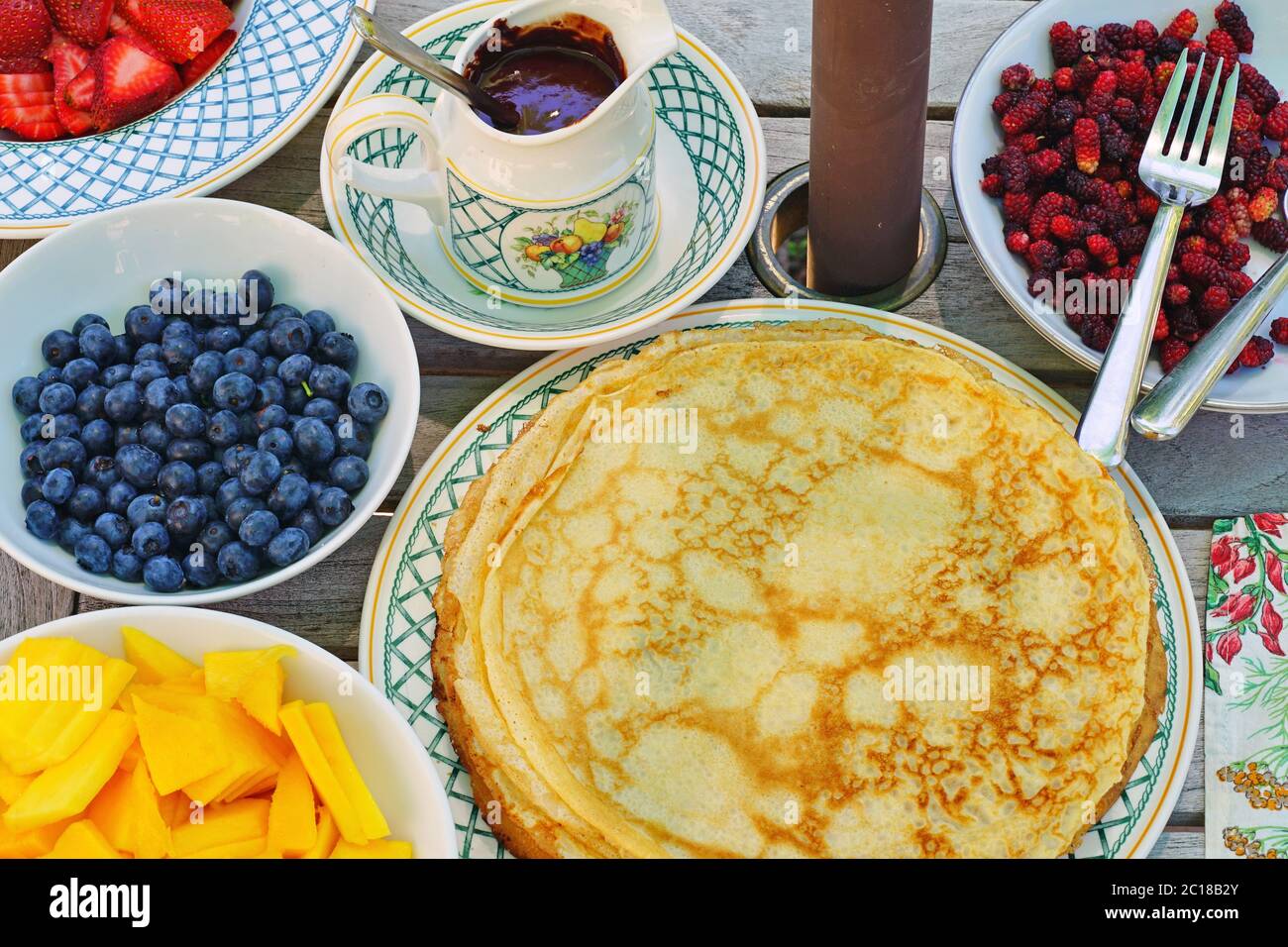 Stack of crepes with fresh fruit Stock Photo - Alamy