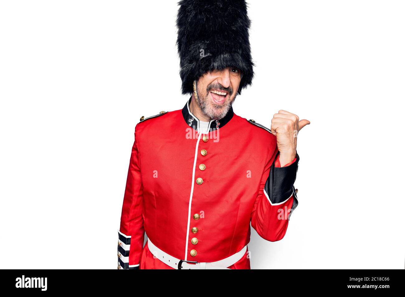 Middle age handsome wales guard man wearing traditional uniform over ...