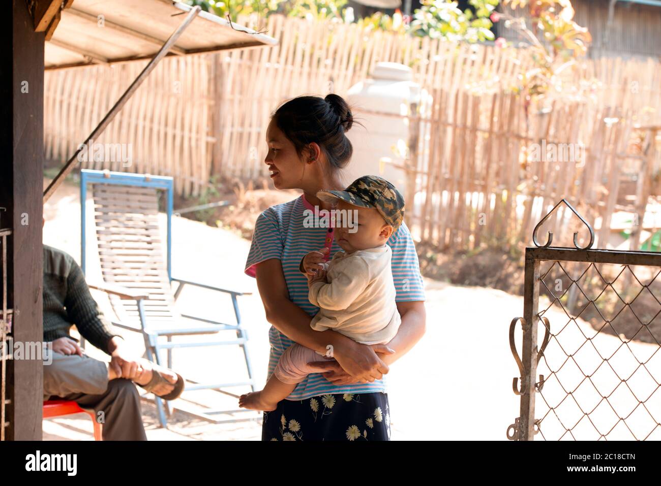 An indigenous, ethnic Shan woman and her baby in Kong Mung Mong village ...