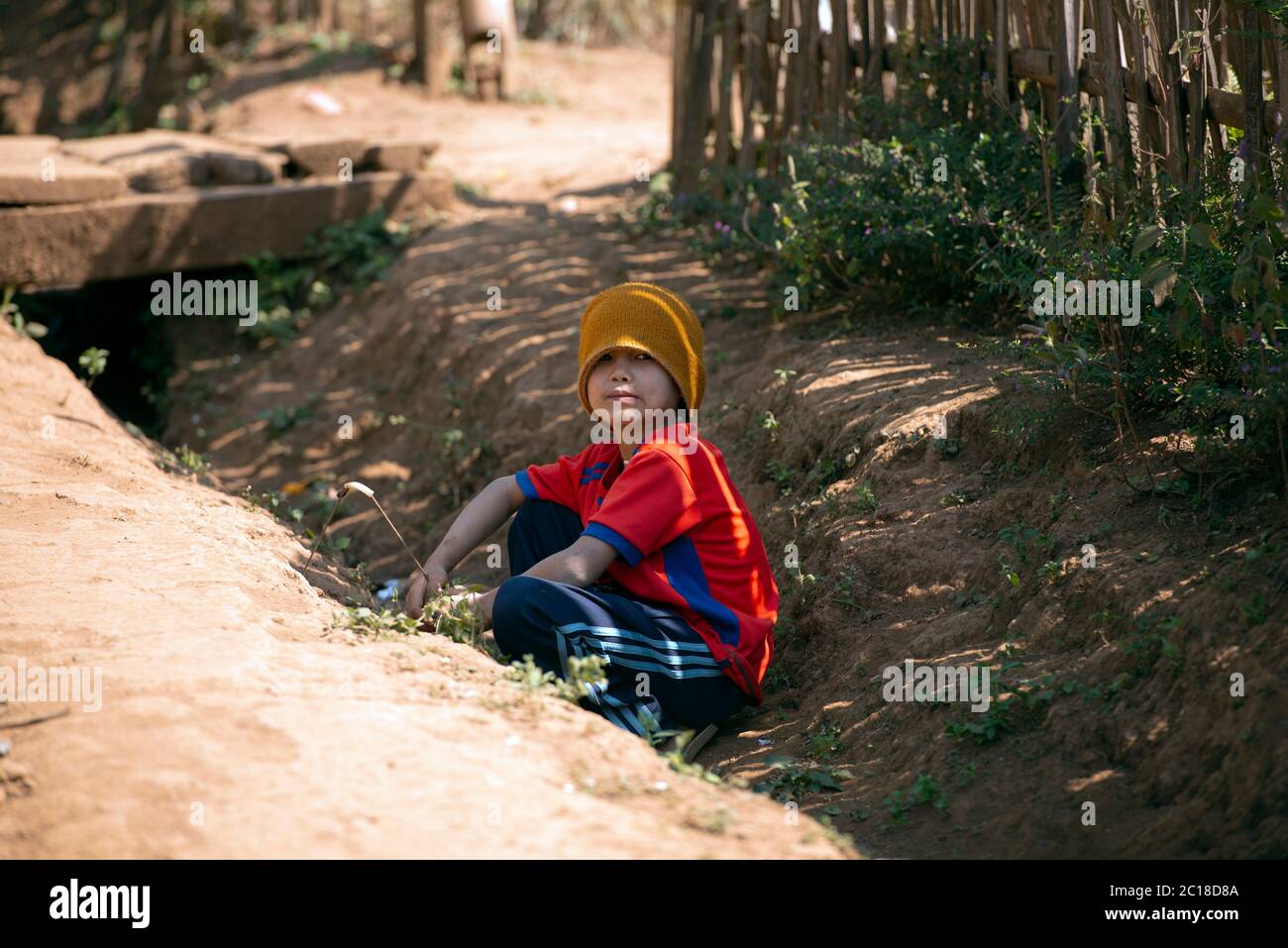 An indigenous, ethnic Shan boy in Kong Mung Mong village, Shan State ...